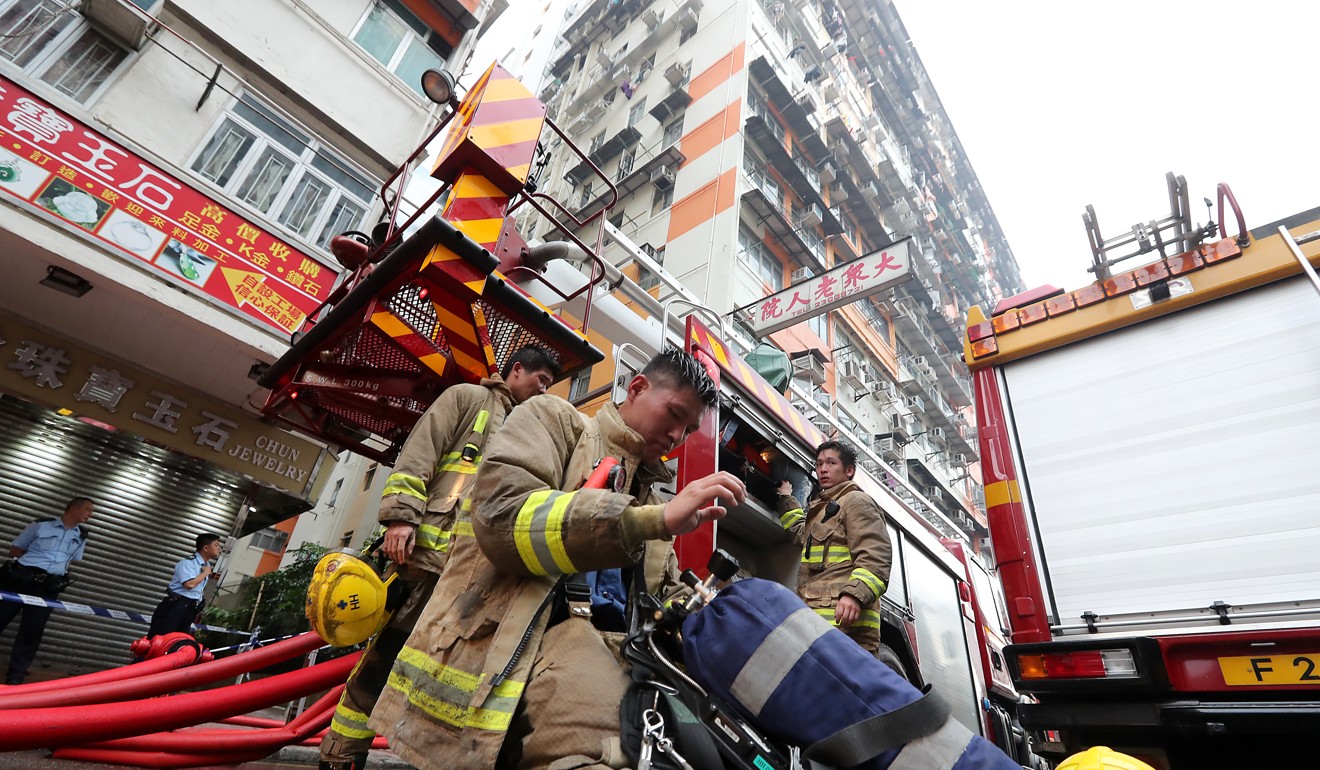 Fire hits Hong Kong residential block, injuring two as 130 others ...
