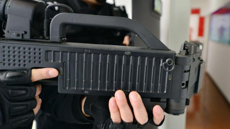 Shanghai police train with ‘bendable guns’ that can shoot around ...